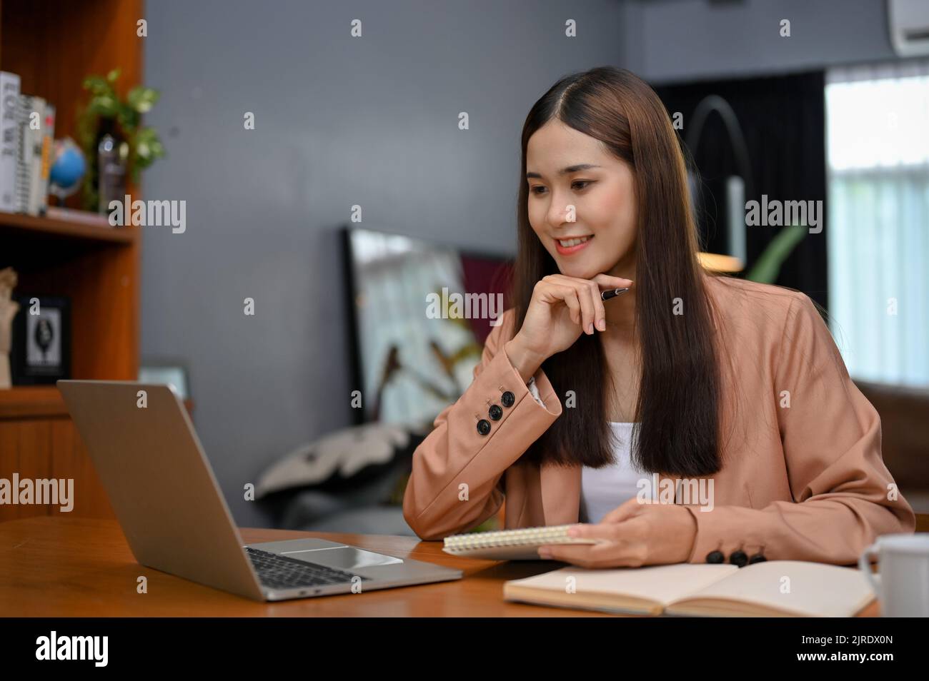 Gorgeous young Asian businesswoman or female office employee at her ...