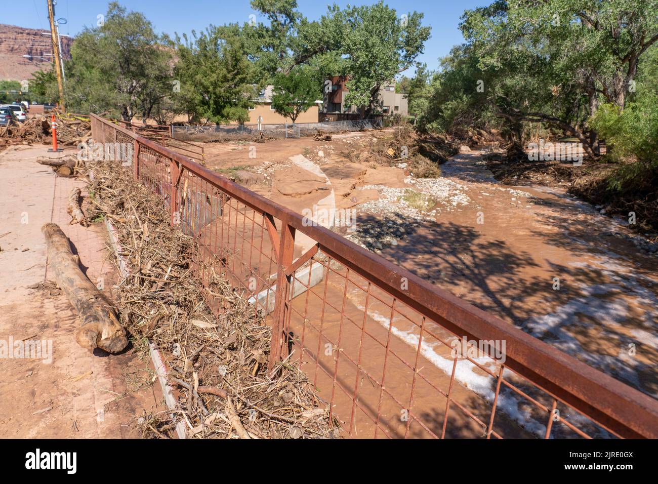 Debris trapped against a bridge guardrail over the MIll Creek Parkway ...