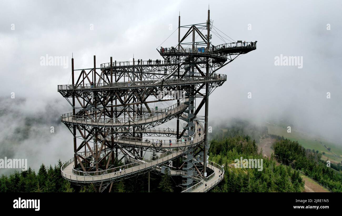 Tourists enjoy Sky Walk, a wooden structure 55 metres above the ground ...