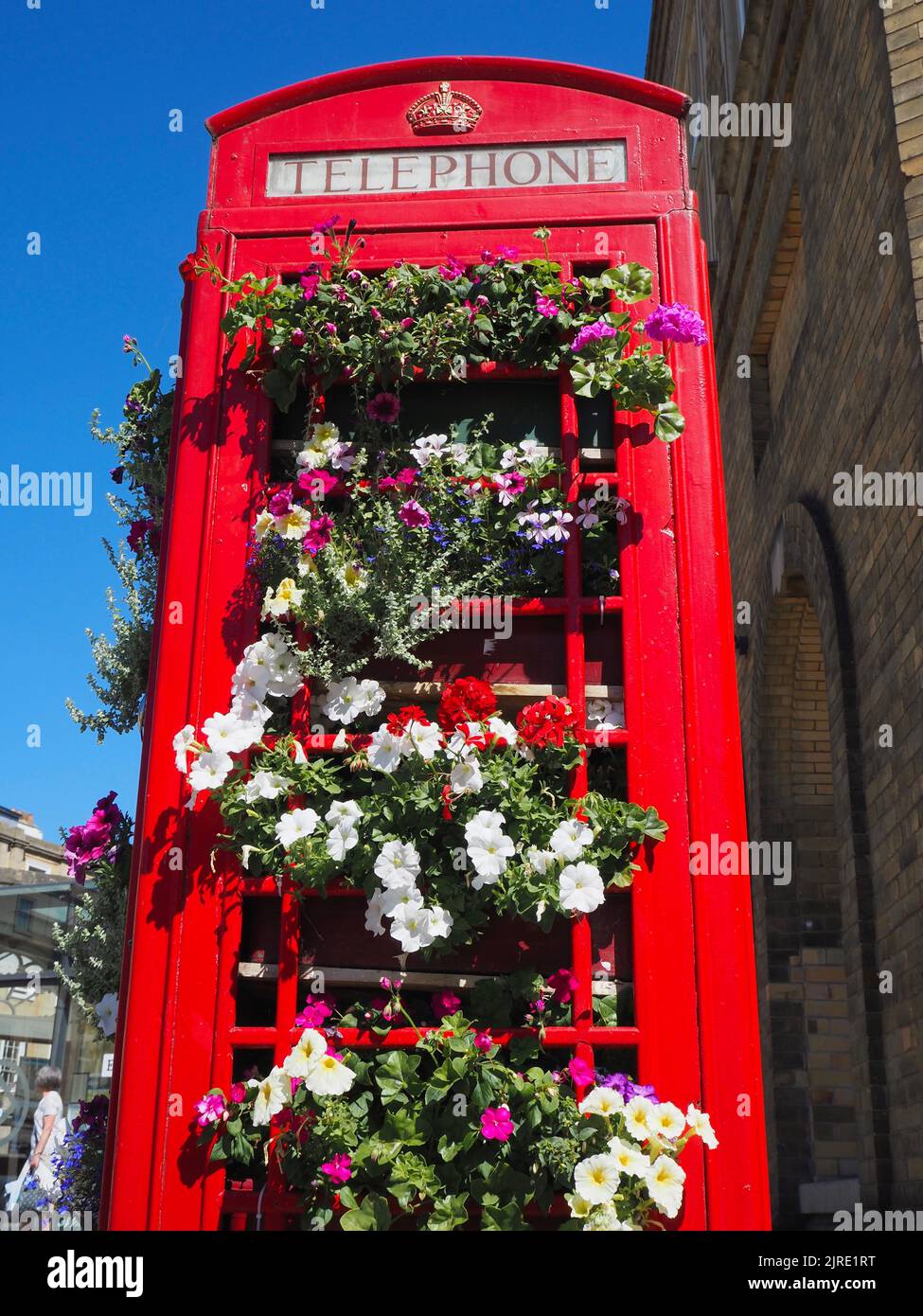Re-purposed telephone kiosk with display of Summer flowers, Bath ...