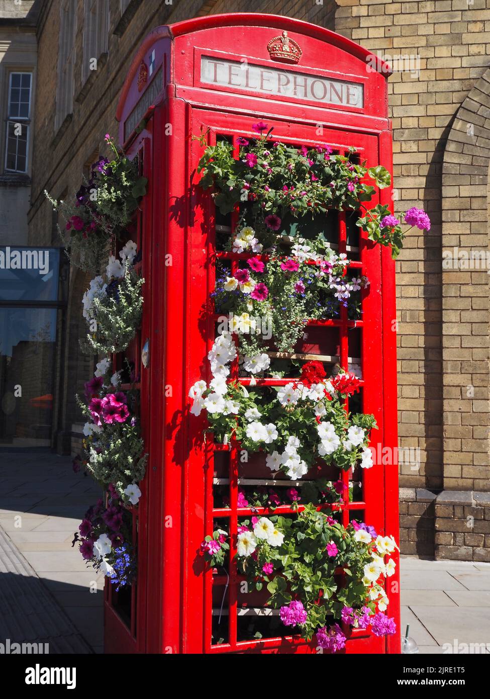 Re-purposed telephone kiosk with display of Summer flowers, Bath ...