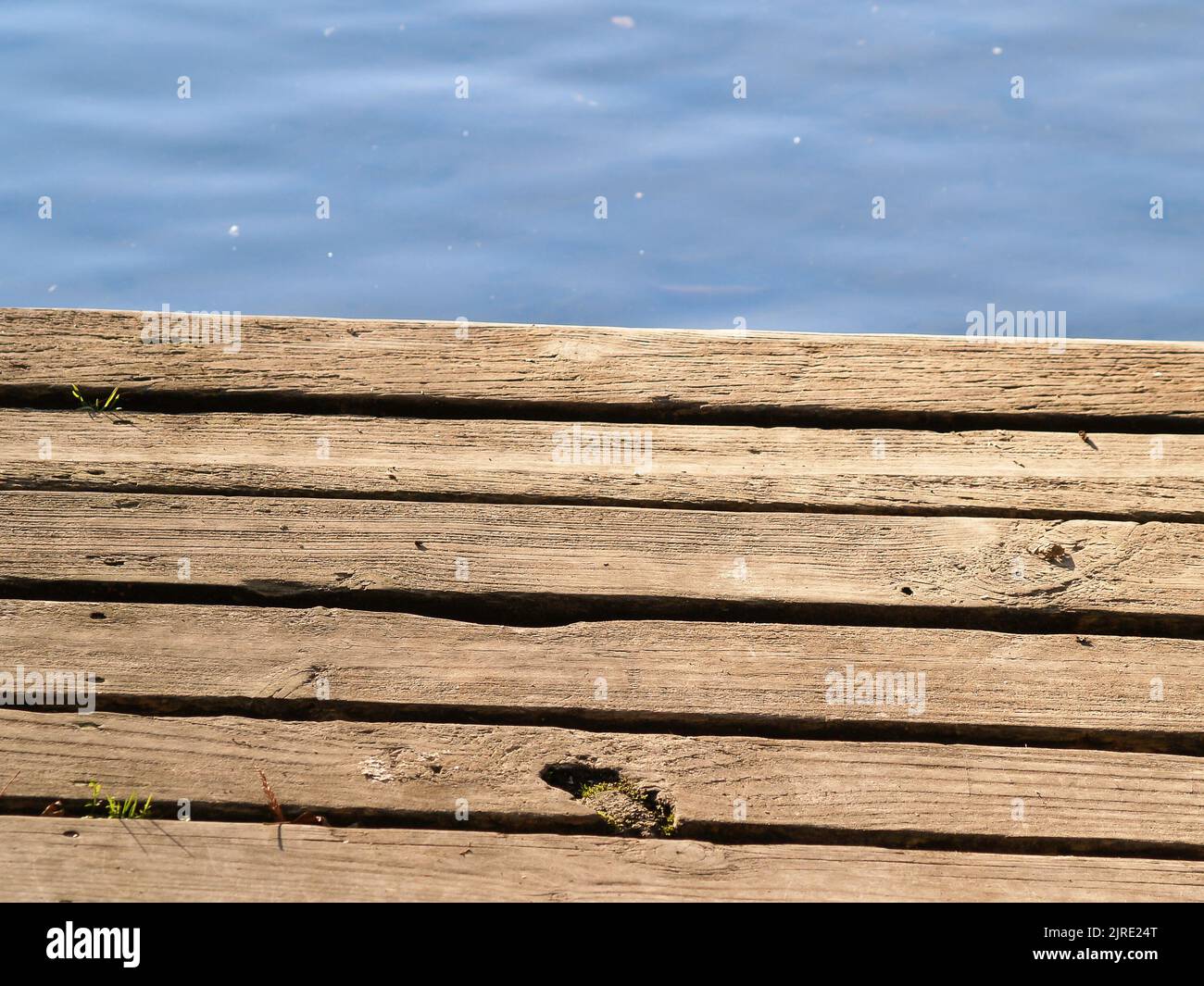 Wooden planks comprising deck over water to provide access Stock Photo ...