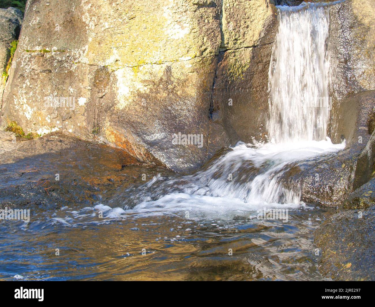 Stream and waterfall over rocks at McLaren Falls Park and Lake Stock ...