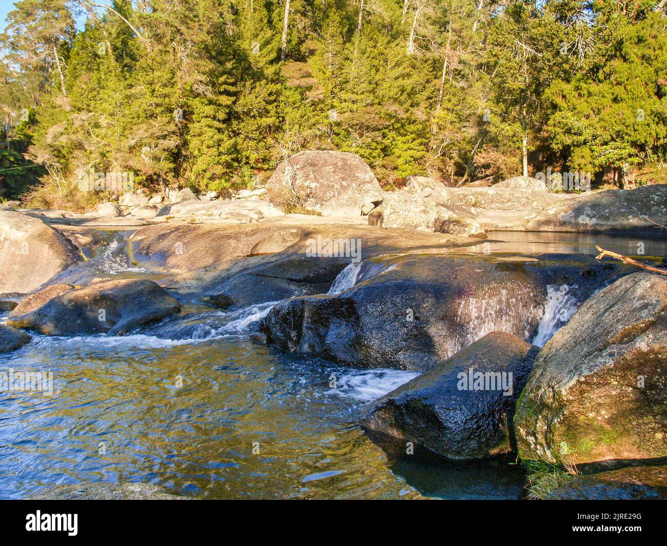 Stream and waterfall over rocks at McLaren Falls Park and Lake Stock ...