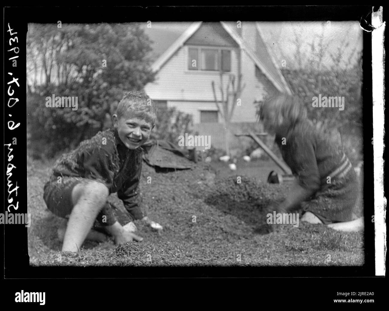 Two children in a garden, 06 October 1934, by Frederick Butler. F B ...