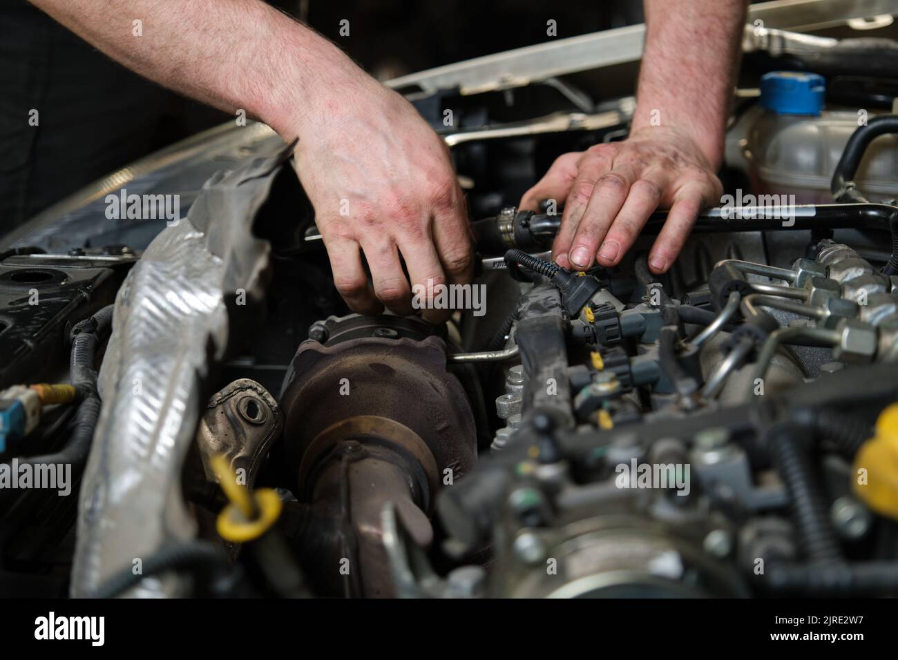 Close up of car mechanic hands doing car service and maintenance Stock ...