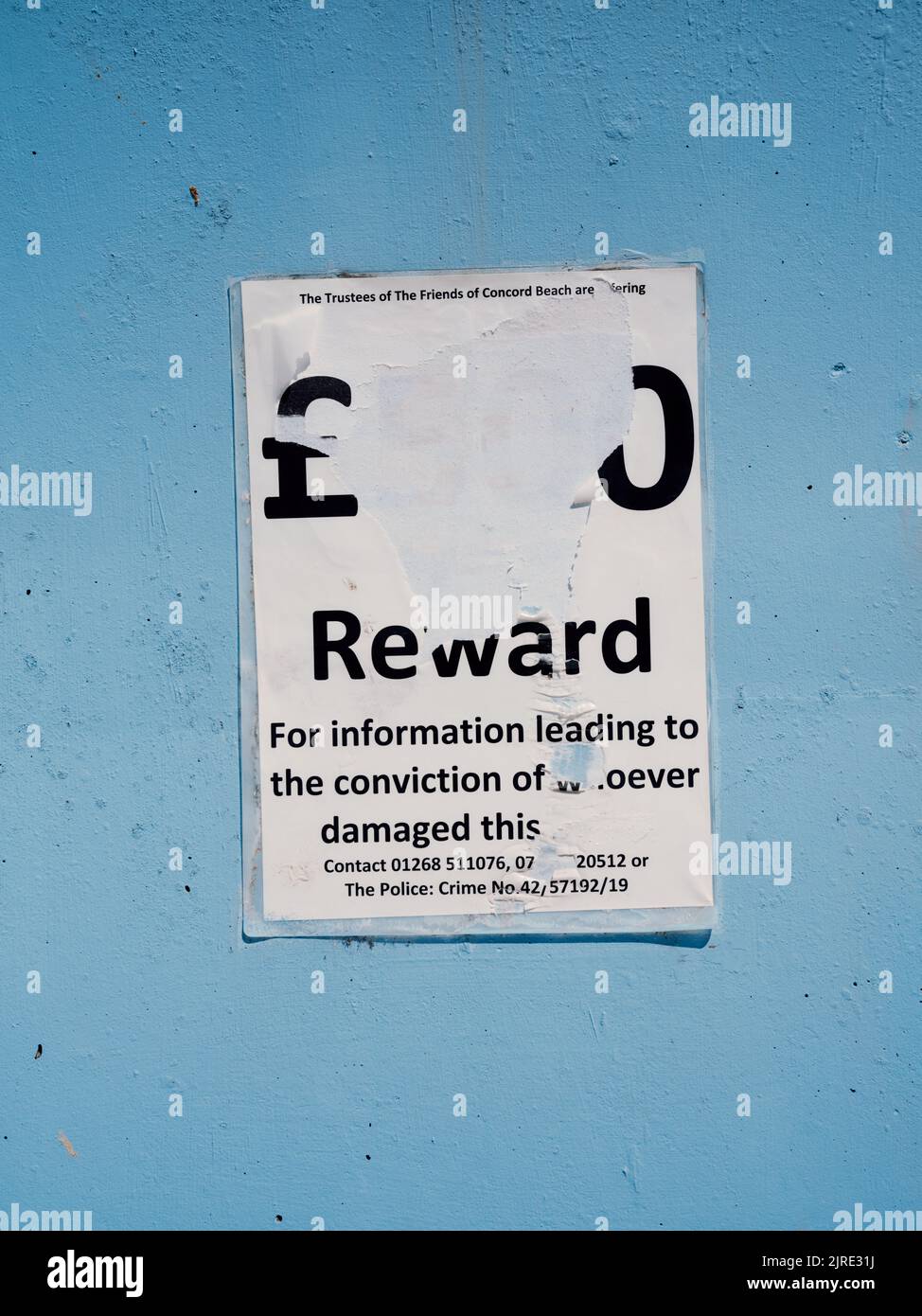 A damaged reward notice sign poster offering a reward for information ...