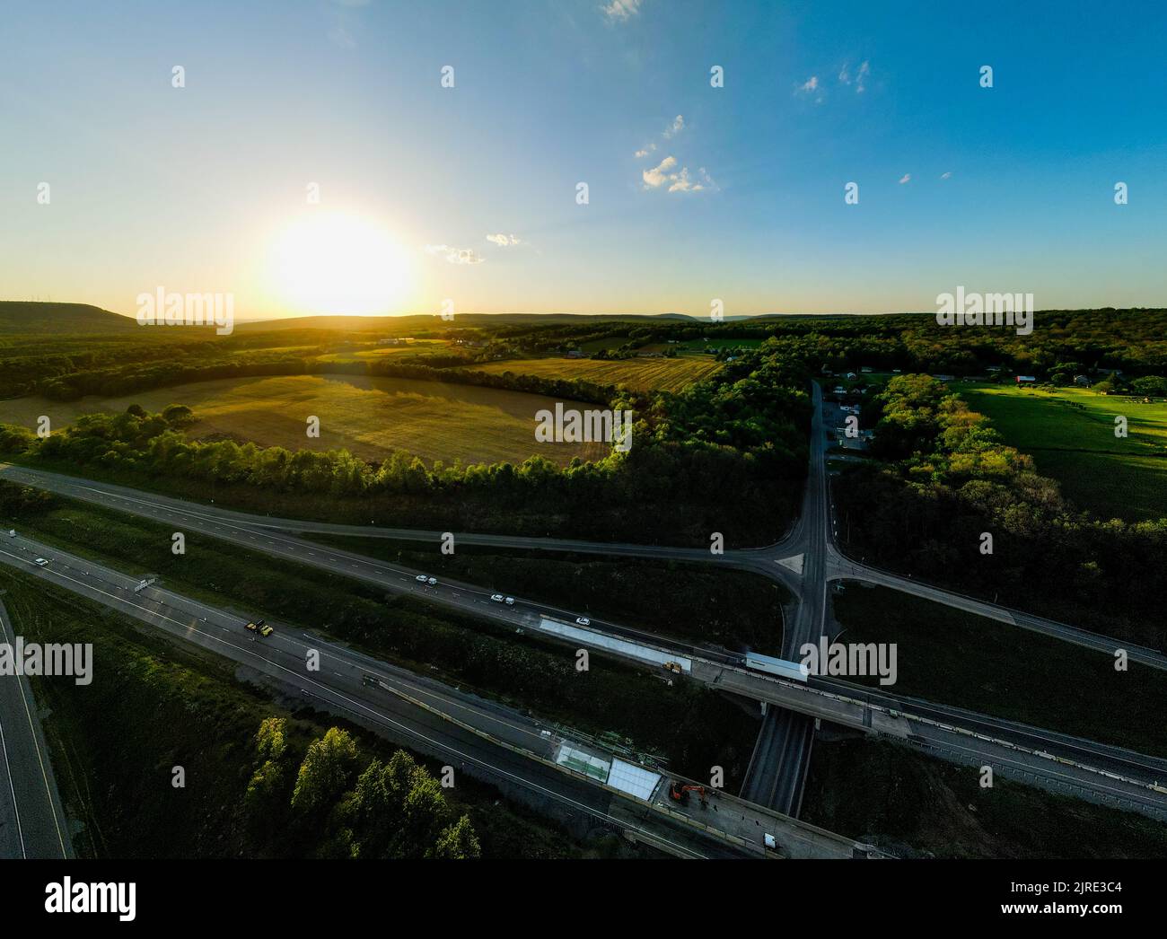 The beautiful drone landscape over lush farm fields and highways under ...