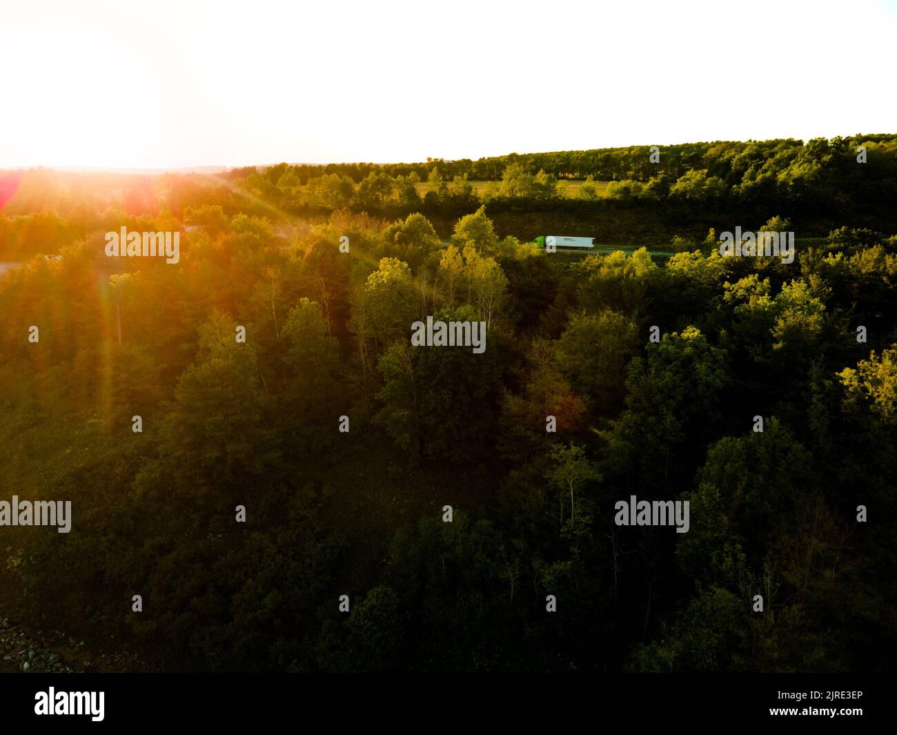 The beautiful drone landscape over green lush forests and highways ...