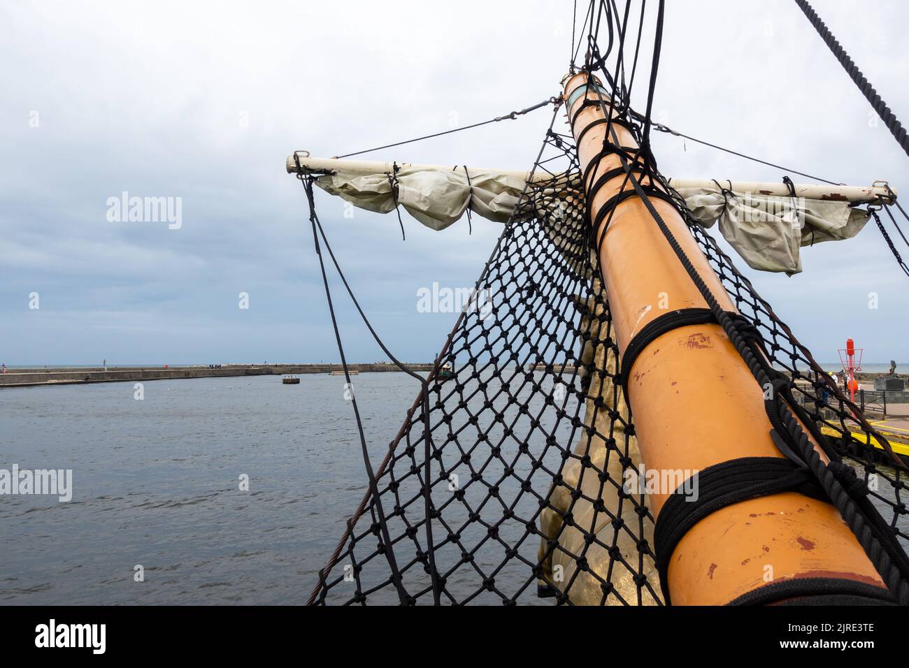 View of the bow of a wooden sailing ship leaving the port. Photo taken ...