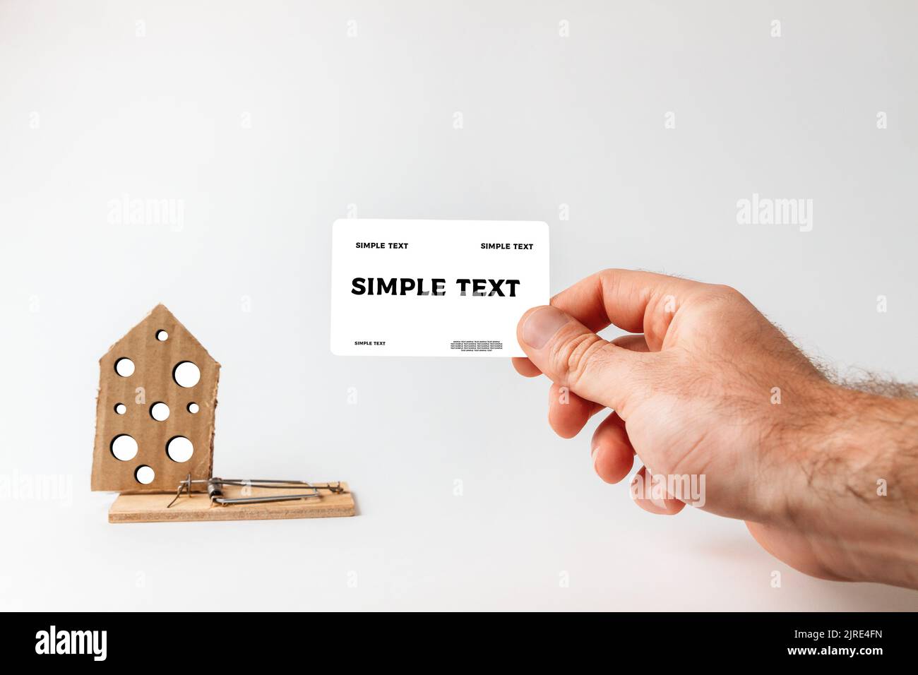 Concept of Bank investments and risks. A man's hand holds a Bank card ...