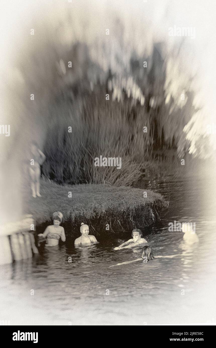 group of people wild swimming in river waveny geldeston norfolk england ...