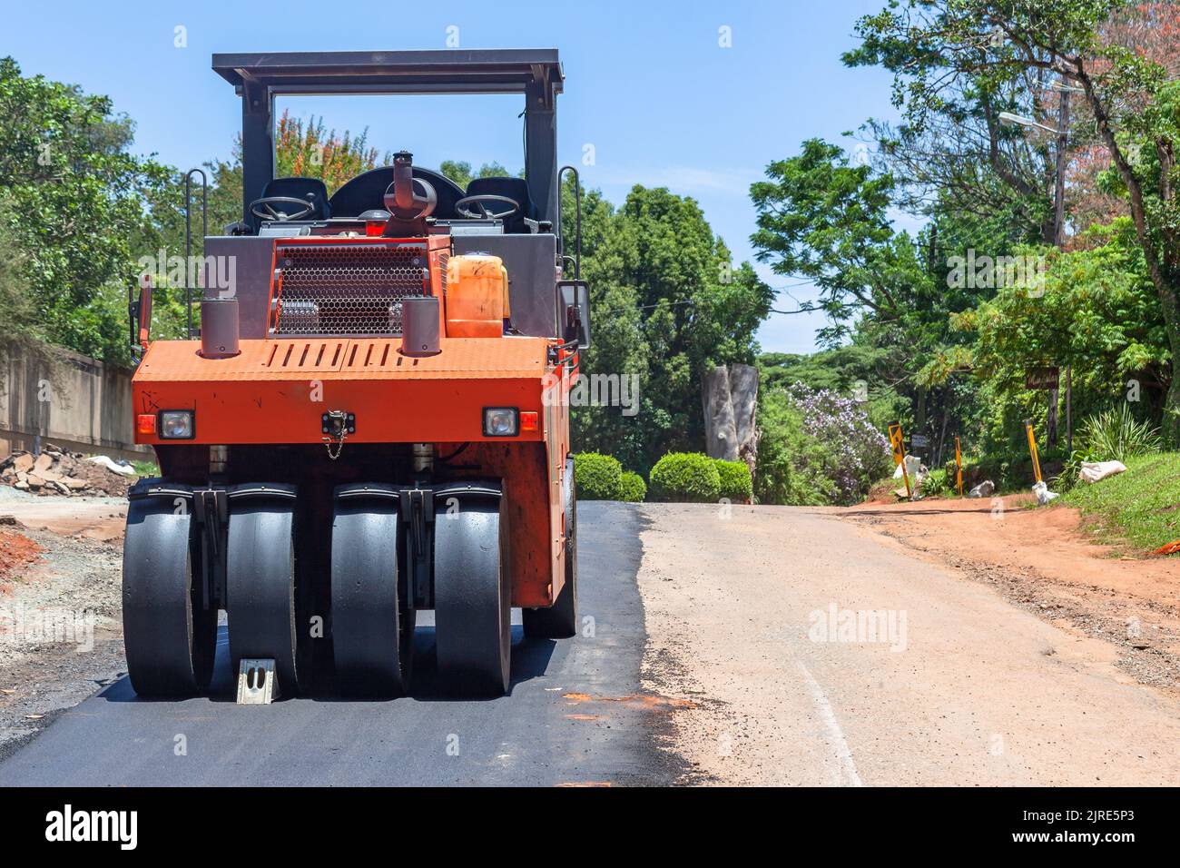 Road new asphalt tar with roller industrial machine vehicle in local ...