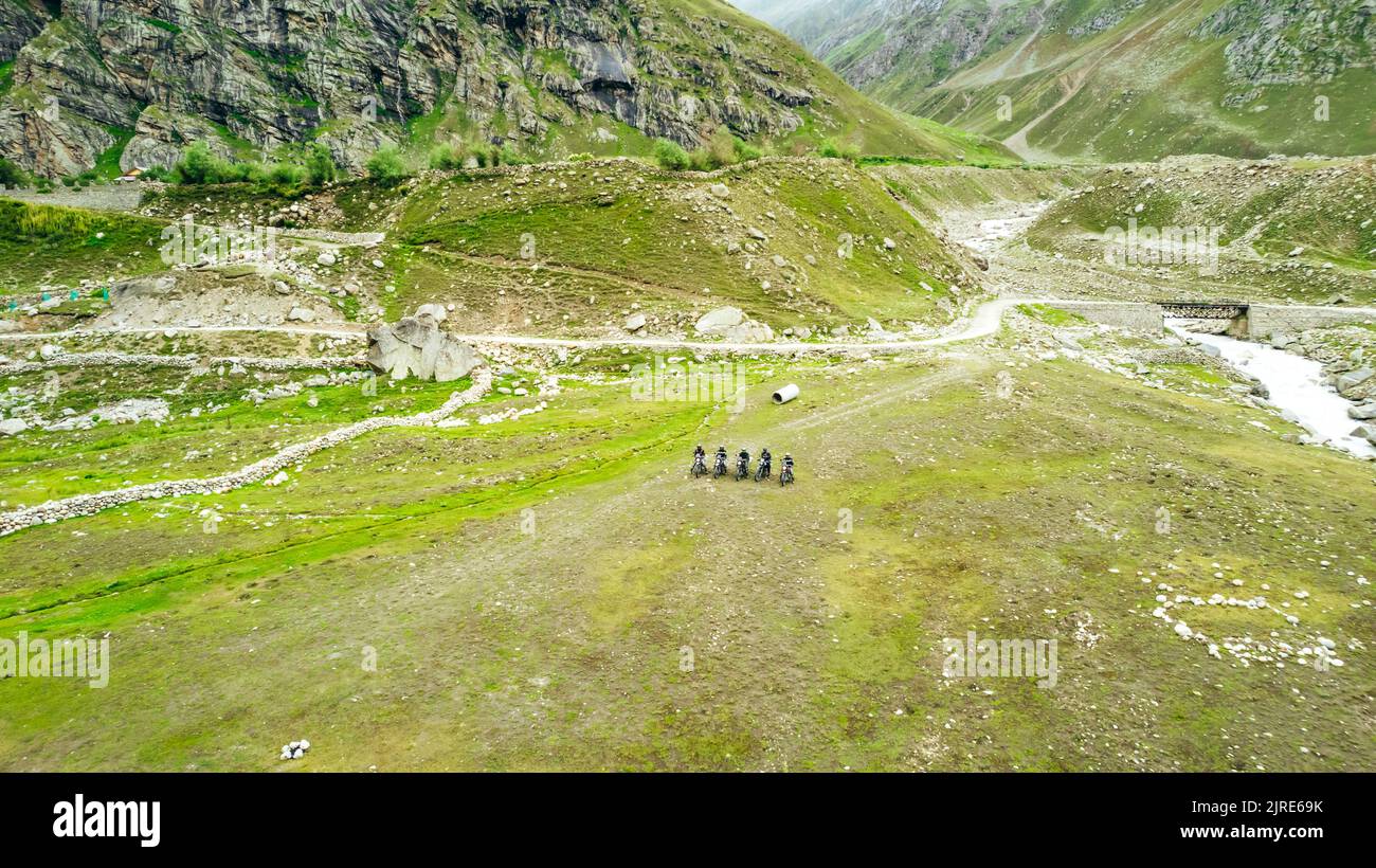 wide aerial of motorcycle tour group in Spiti Valley of Himachal ...