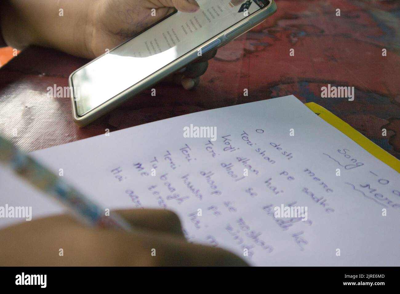 Digital learning by a kid using a mobile phone Stock Photo - Alamy