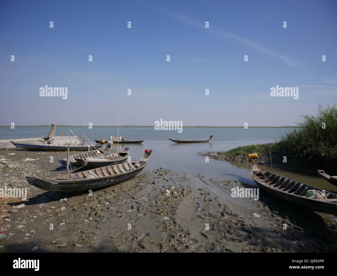 The boats on the shore in Yoe Ngu Village, Myanmar, on a sunny day ...
