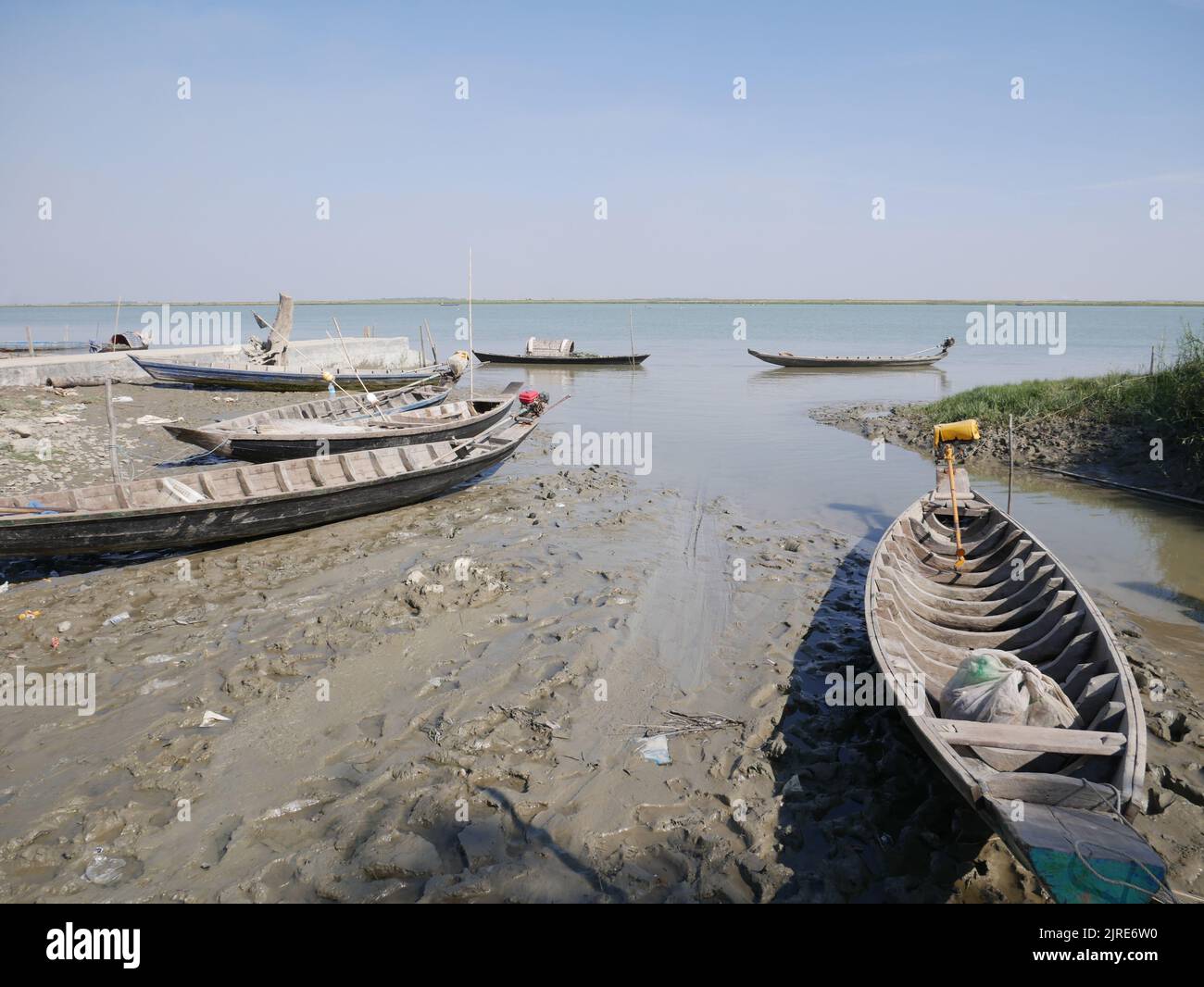 The boats on the shore in Yoe Ngu Village, Myanmar, on a sunny day ...