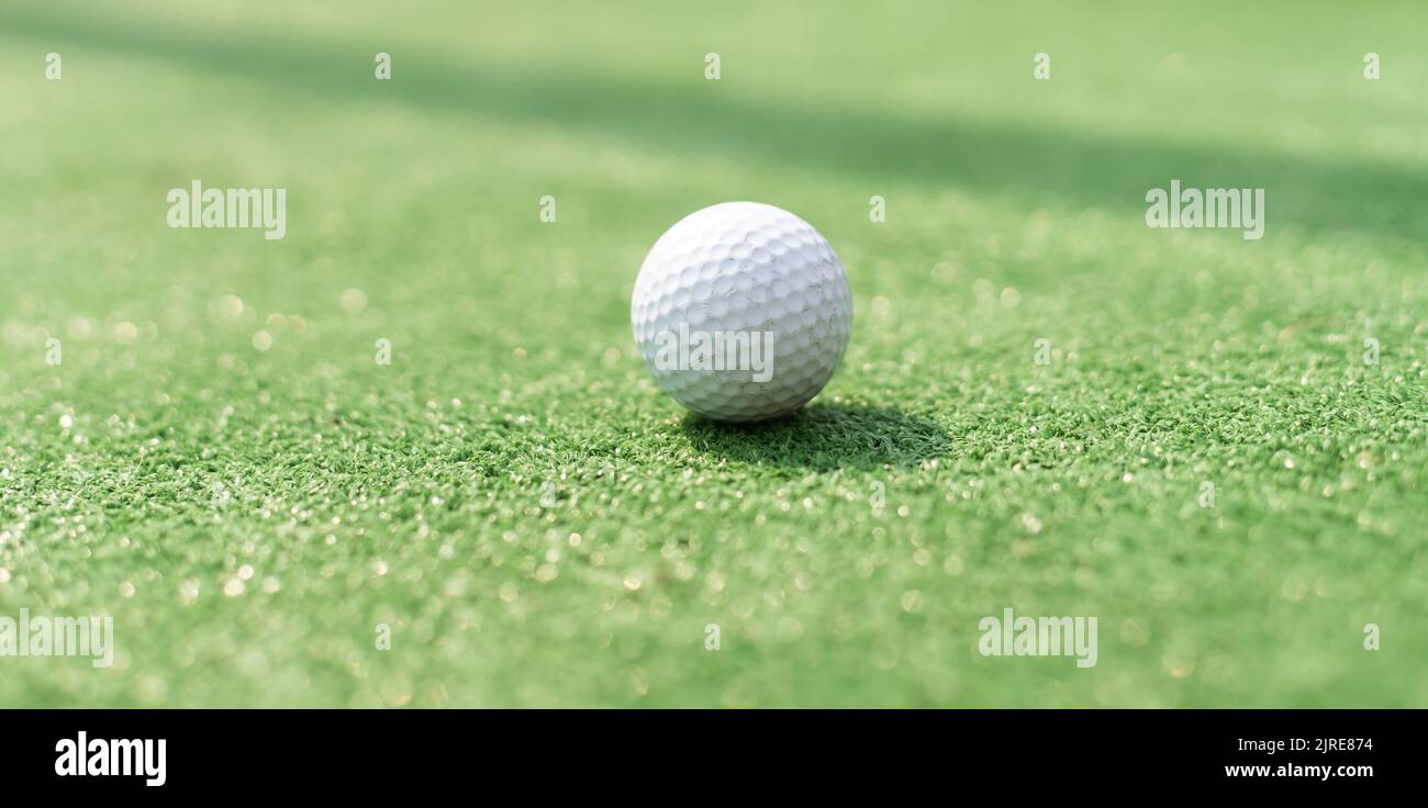 Mini-golf ball on artificial grass. Summer season game Stock Photo - Alamy