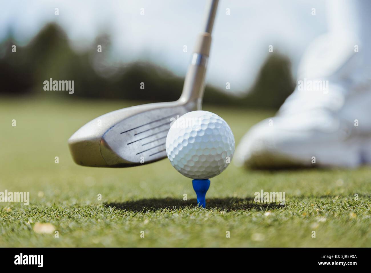 Golf ball on tee ready to start game. Golf driver before swing ready ...