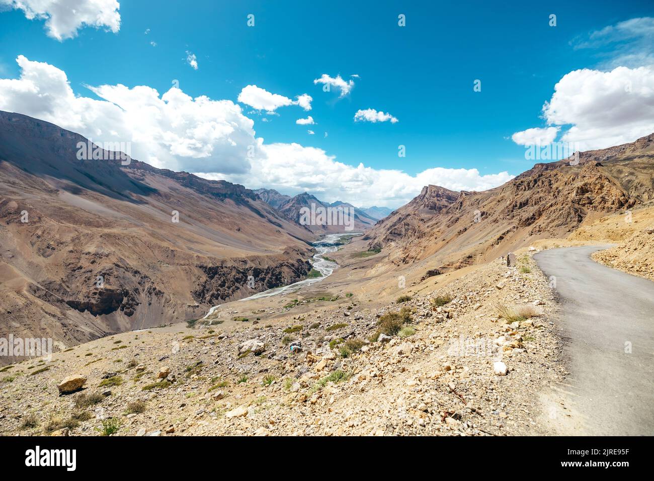 paved road at high altitude in the dry desolate mountains of Spiti ...