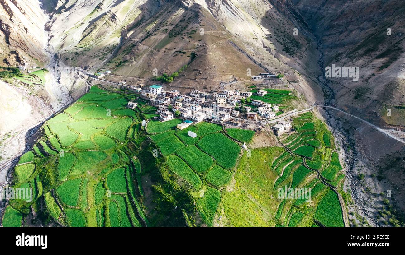 wide aerial landscape of lush green farmland in Mud Village during ...