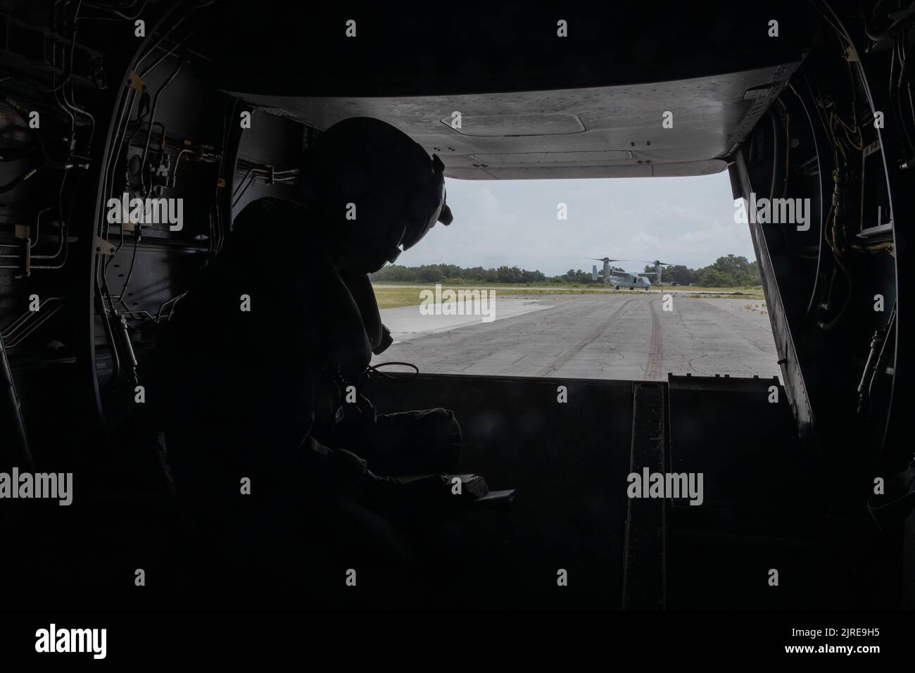 A Marine aboard an MV-22B Osprey, both assigned to Marine Medium ...