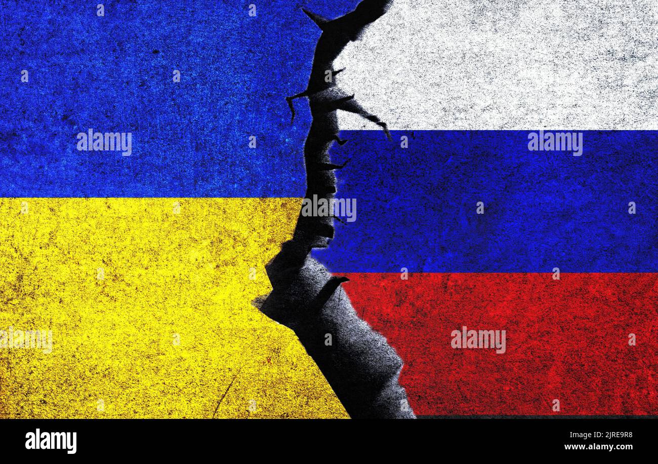 Ukraine vs Russia concept flags on a wall with a crack. Ukraine Russia ...