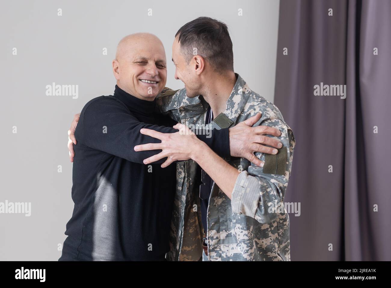 Military father hugs his son when they are reunited after a mission ...
