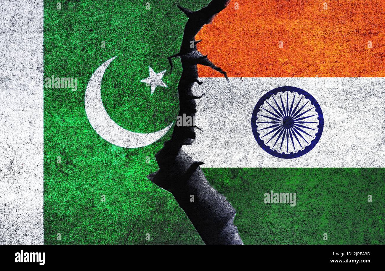 India vs Pakistan concept flags on a wall with a crack. Pakistan and ...