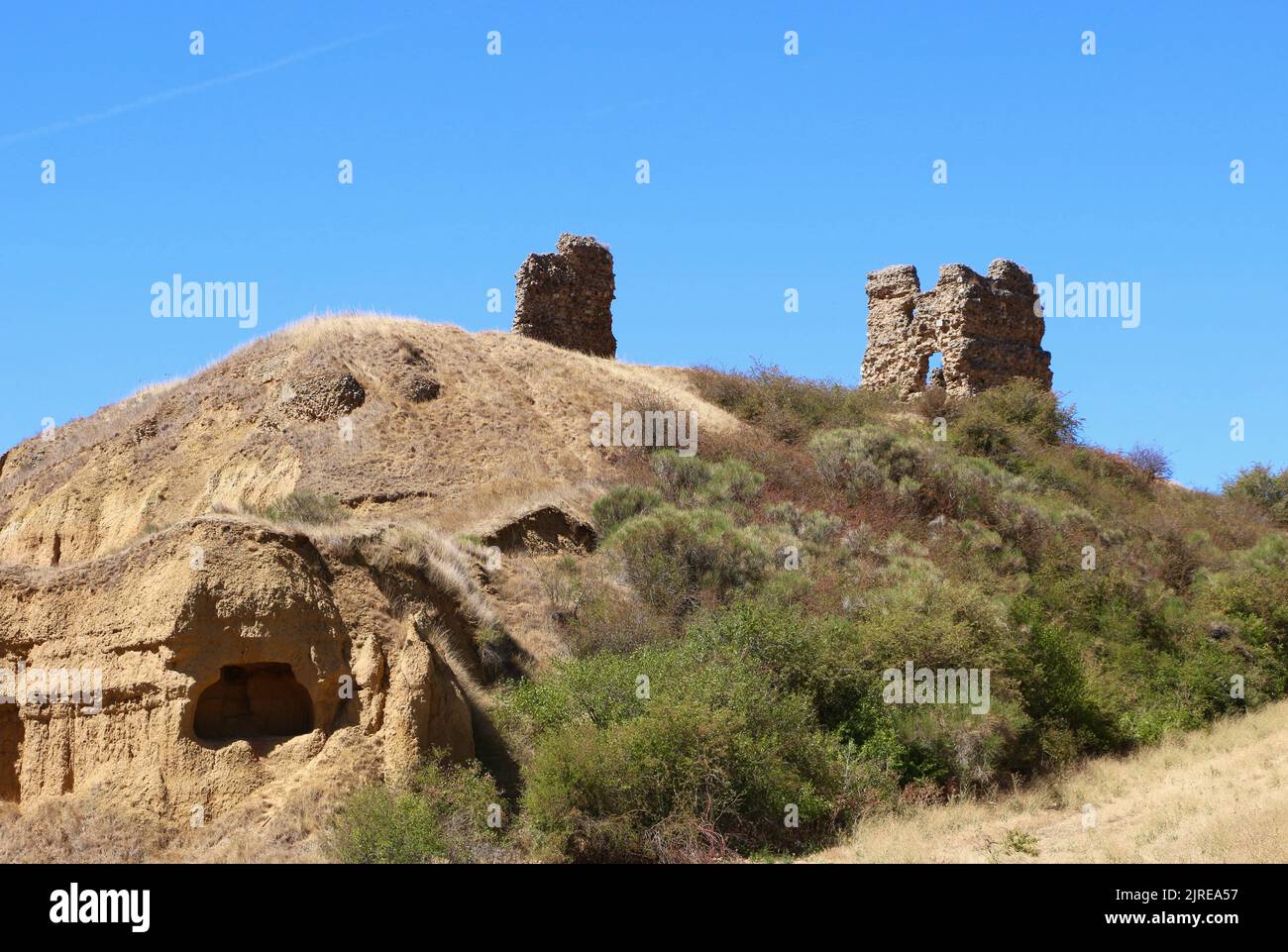 The ruined medieval Castillo de los Condes de Saldaña on a hilltop ...