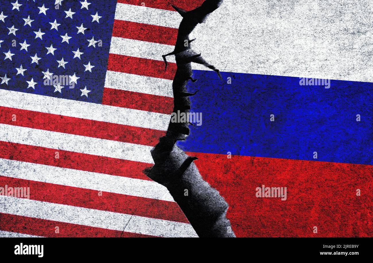 USA vs Russia flags on a wall with a crack. United States of America ...