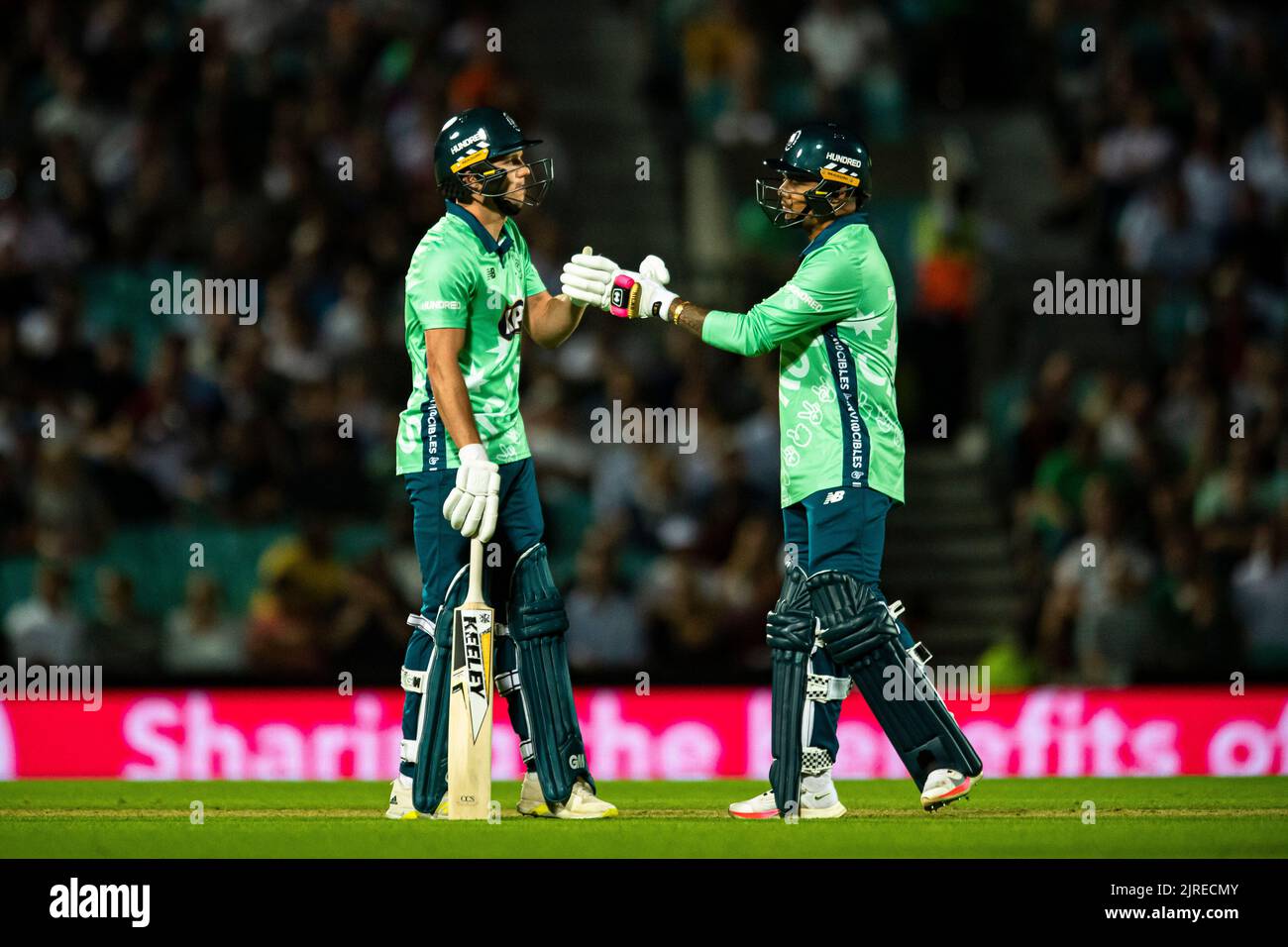 LONDON, UNITED KINGDOM. 23th Aug, 2022. Matt Milins of Oval Invincibles (left) and Sunil Narine ...
