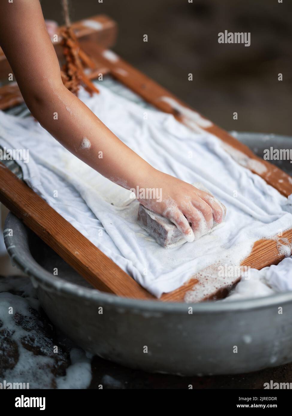 hands of a little girl wash things with soap. retro frame Stock Photo ...