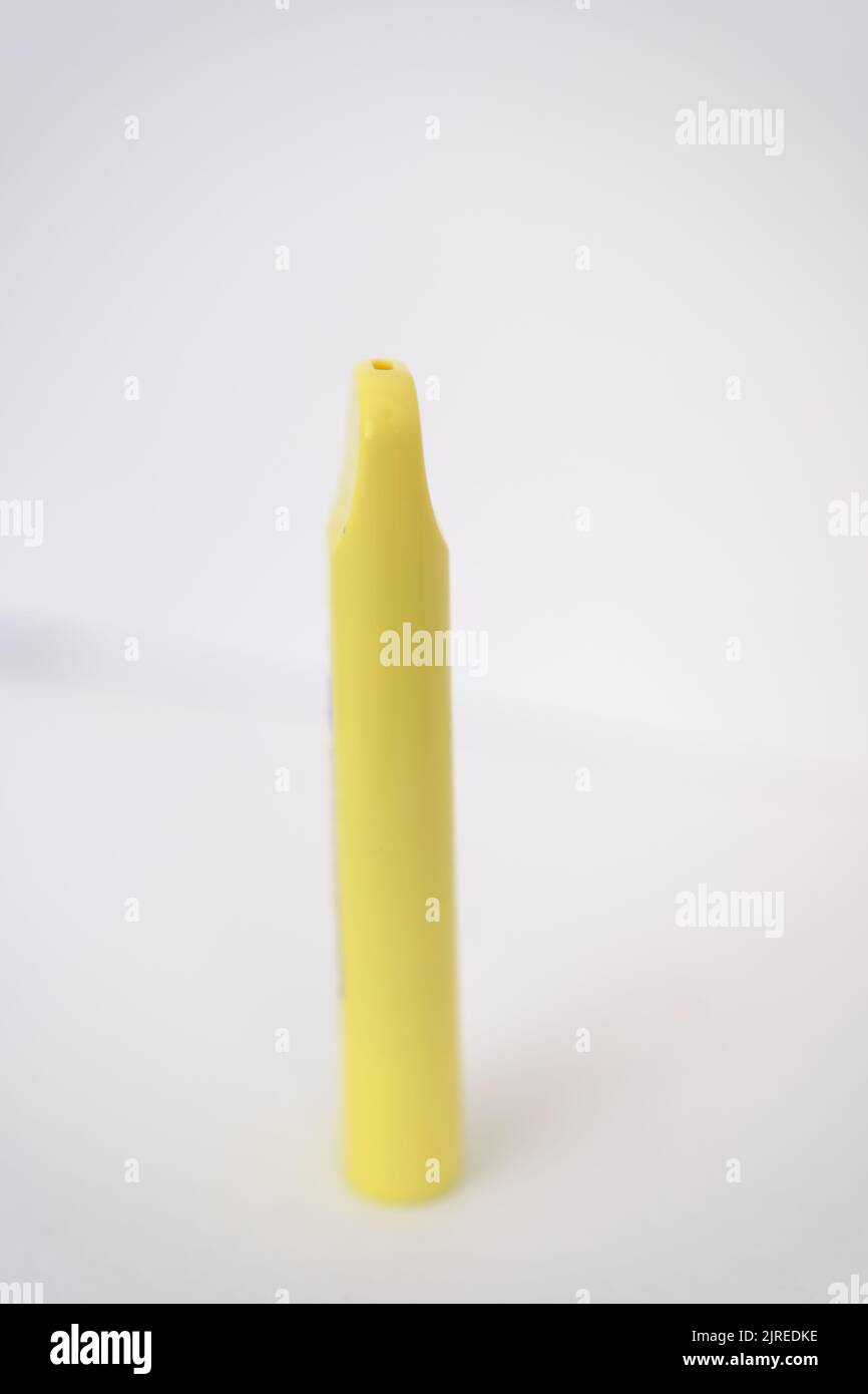 yellow disposable electronic cigarette on white background. Copy space ...
