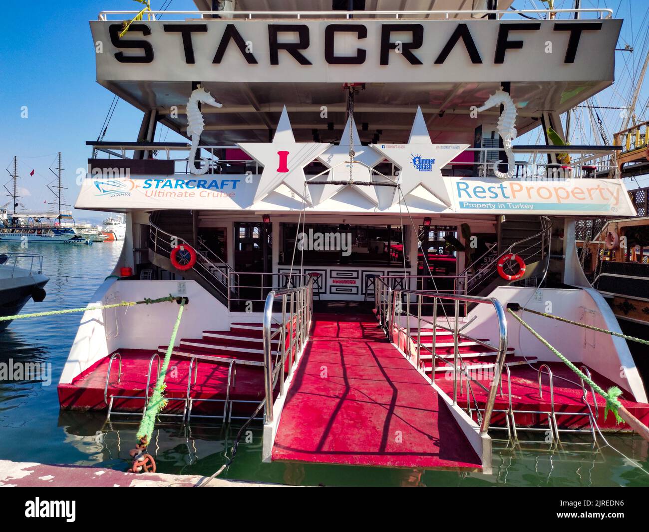 A huge pirate ship in the famous Alanya harbor. Creative decorations on ...
