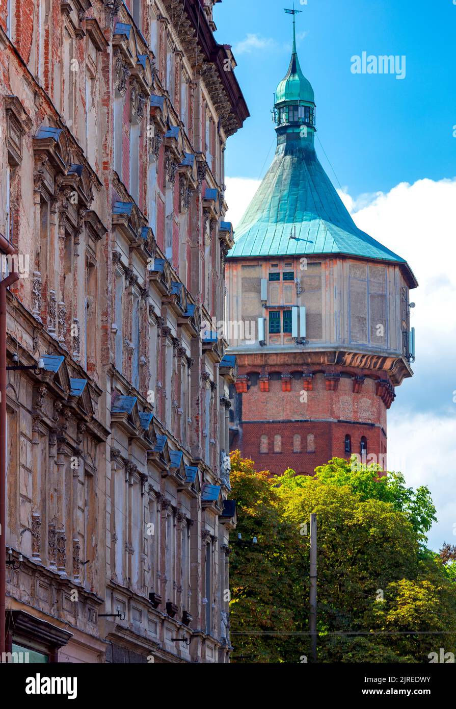 View of the facades of old traditional Polish houses and the tower ...