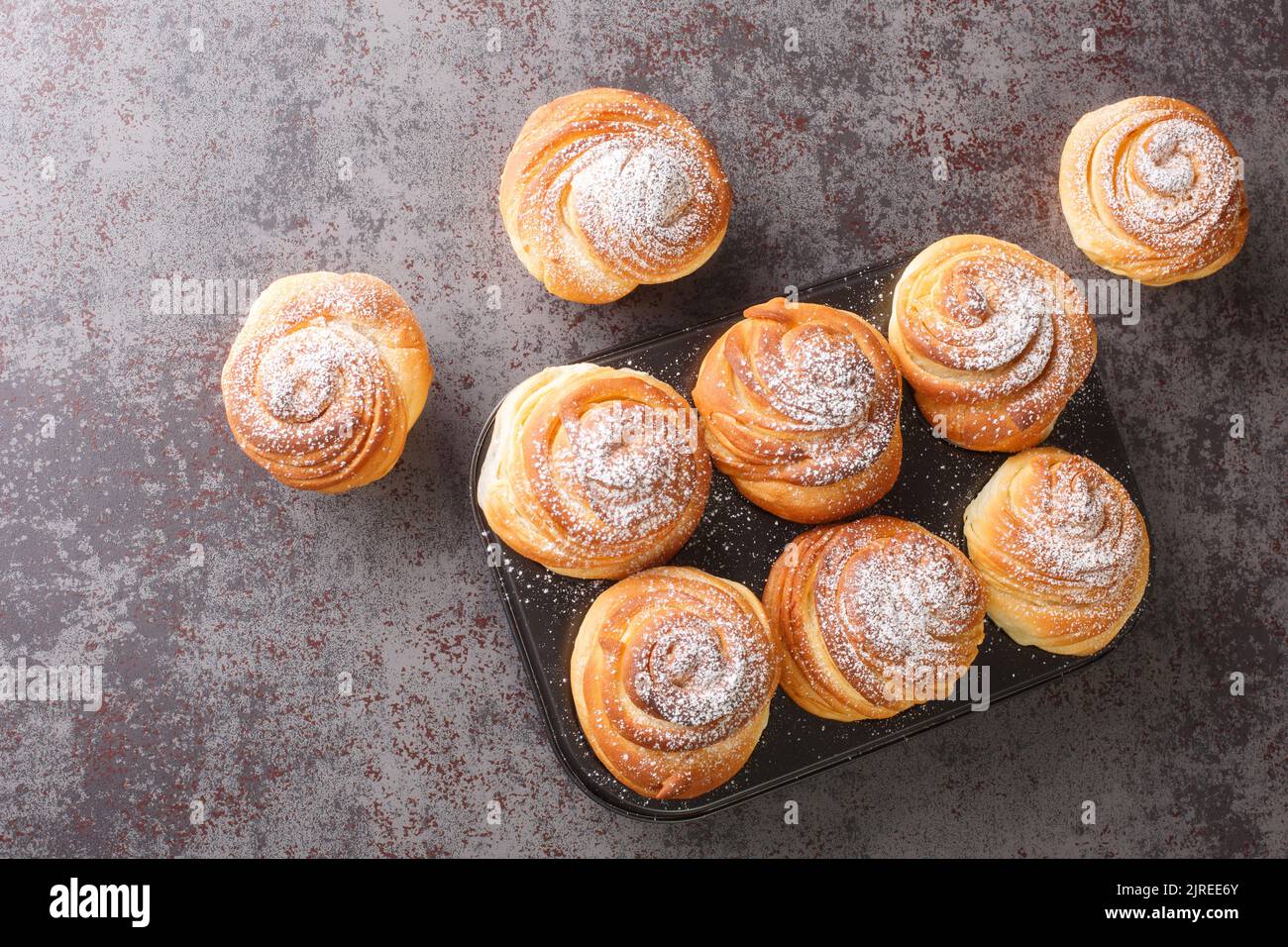 cruffins easter spring pastries, muffin and croissant roll on a dark ...
