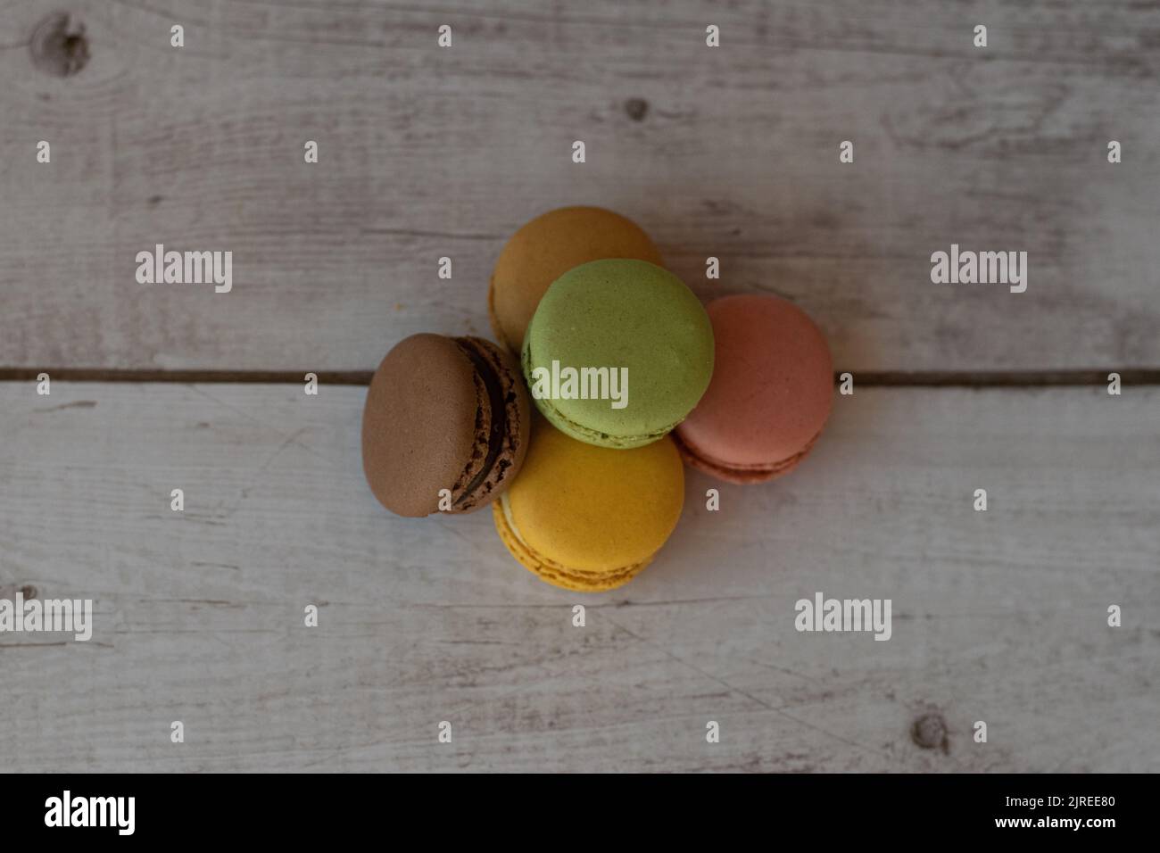 Top view of colored macaroons on white background Stock Photo - Alamy