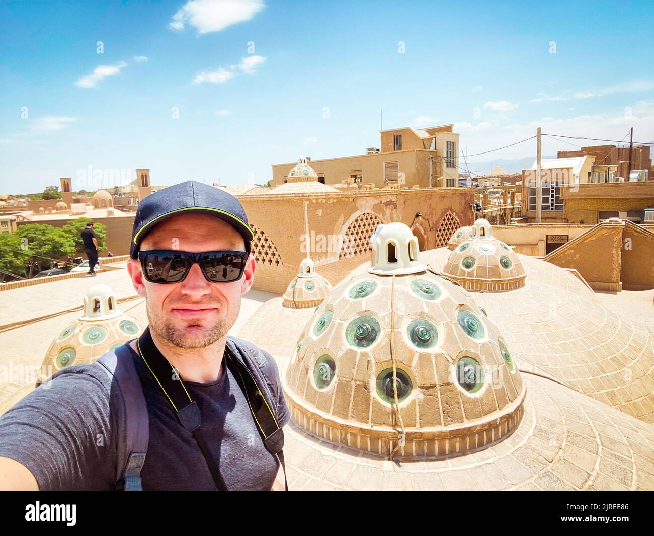 Young caucasian male tourist take selfie on famous bathhouse rooftop in ...