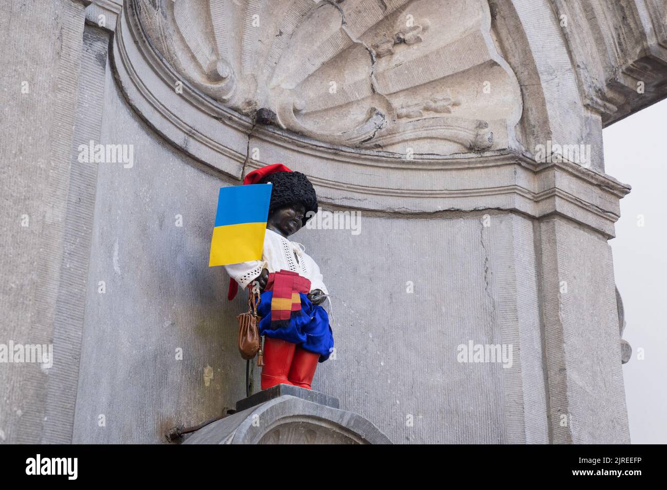 The Manneken Pis statue in the city center of Brussels wears a ...