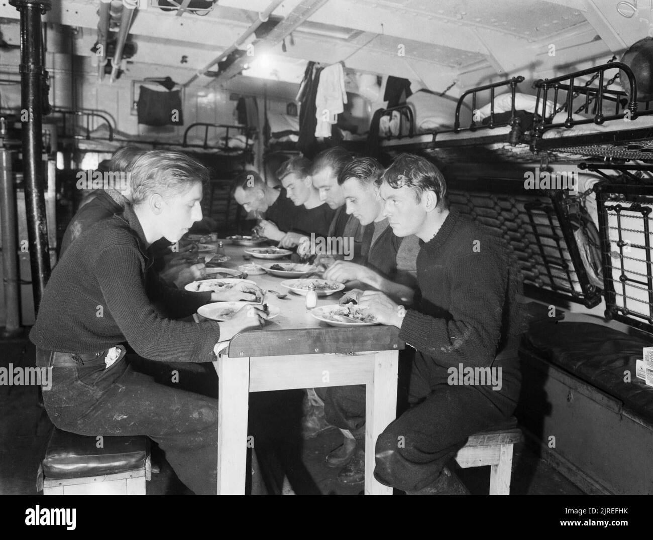 Sailors sit for dinner on board a Royal Navy trawler at Dover, October ...