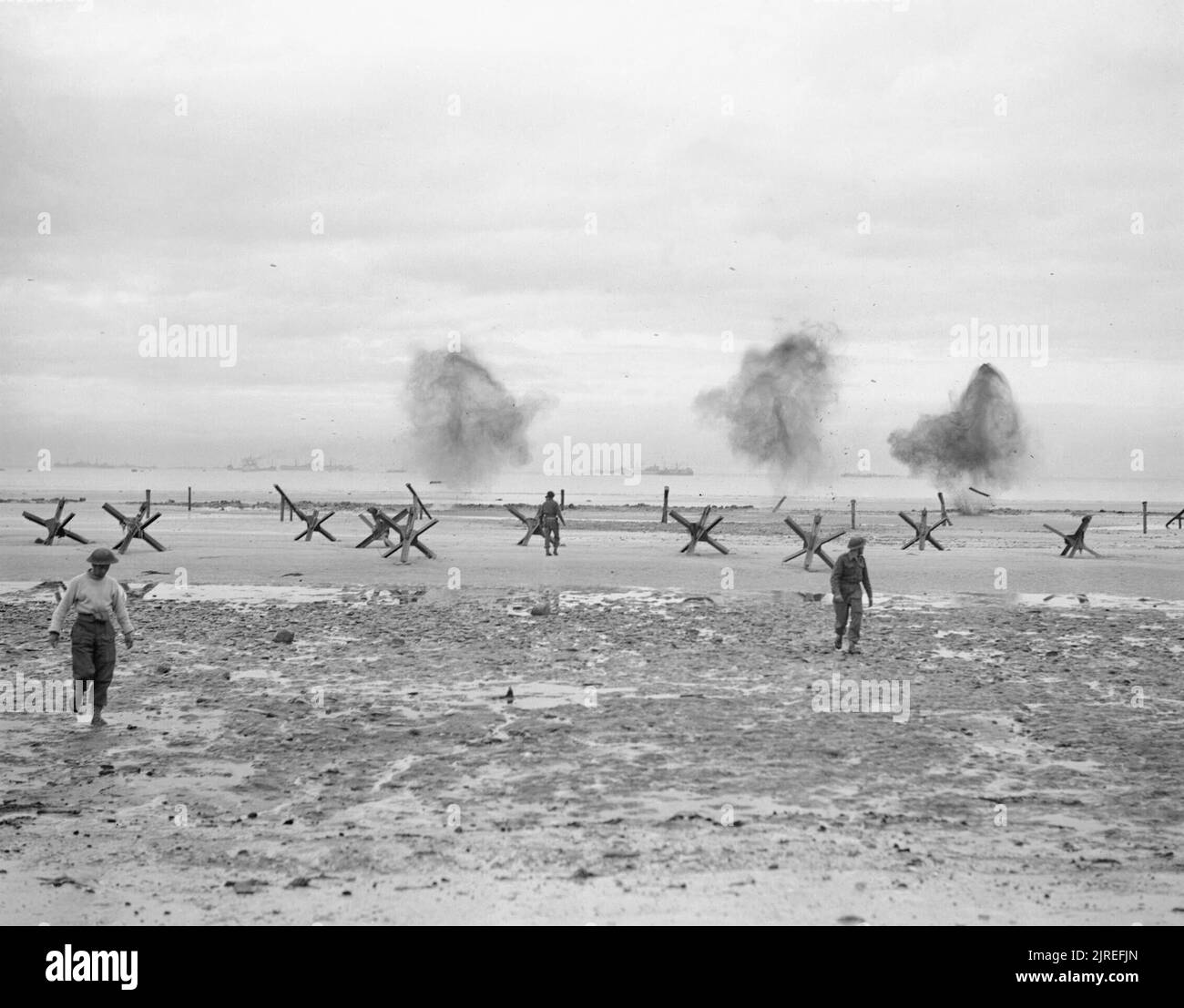 Royal Navy personnel of an ostacle clearance unit blowing up German ...