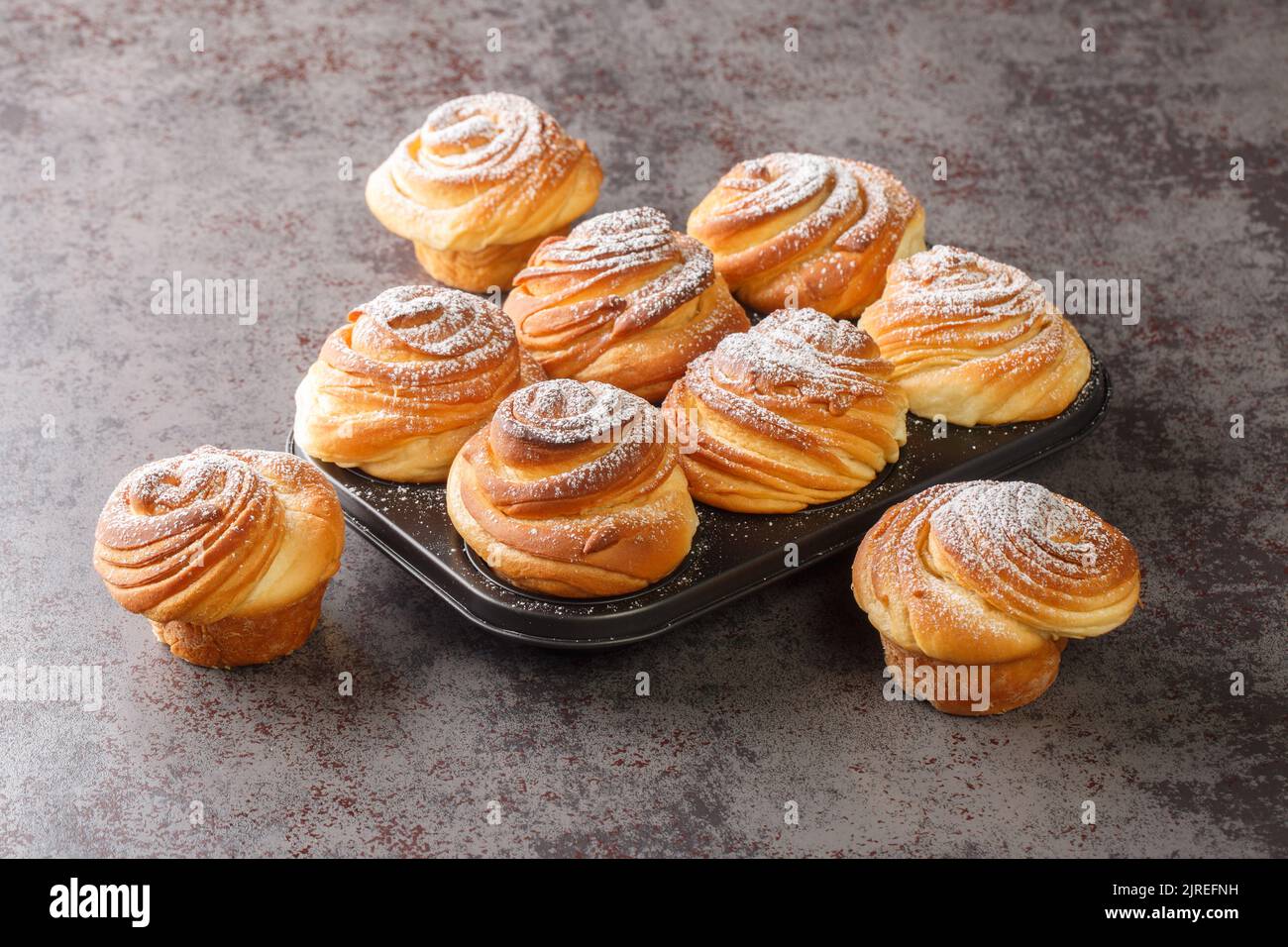 cruffins easter spring pastries, muffin and croissant roll on a dark ...