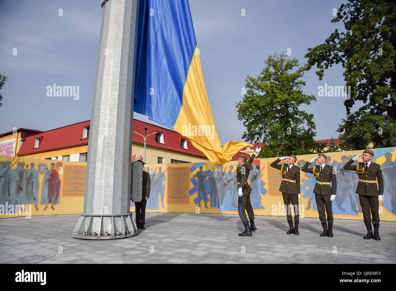 Ukrainian military participate in raising the flag of Ukraine during ...