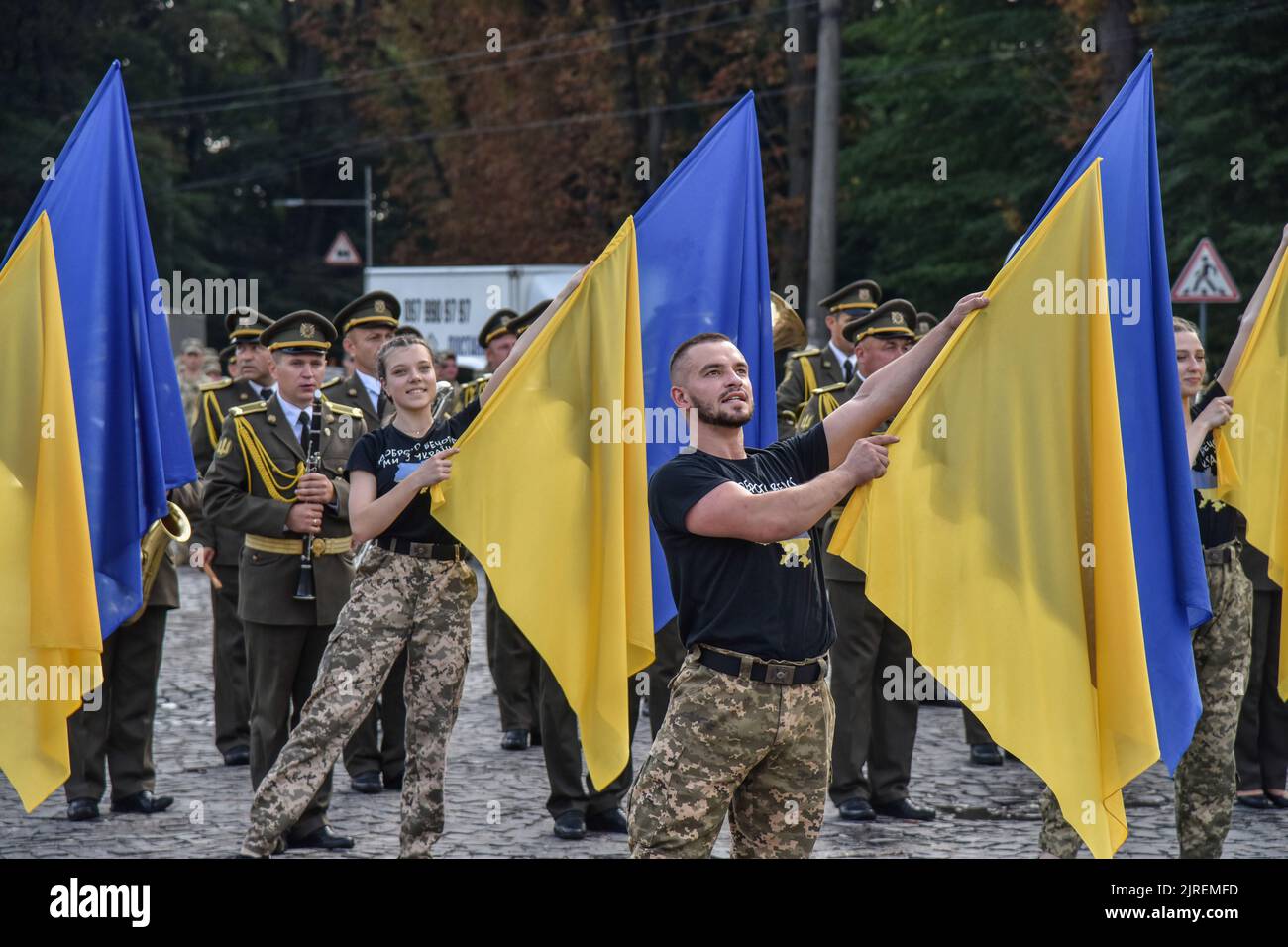 People dance with Ukrainian flags during the National Flag Day ...