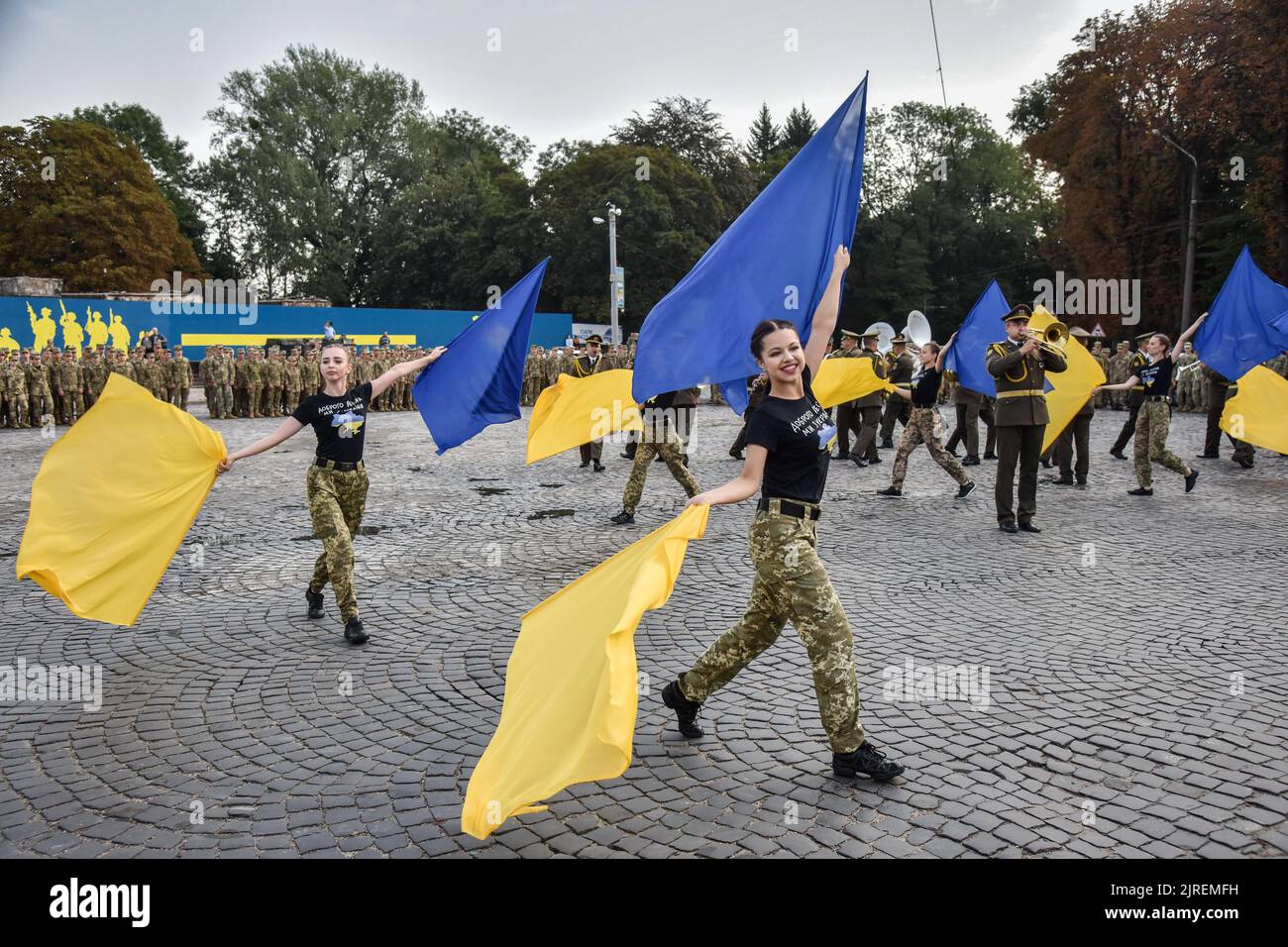 People dance with Ukrainian flags during the National Flag Day ...