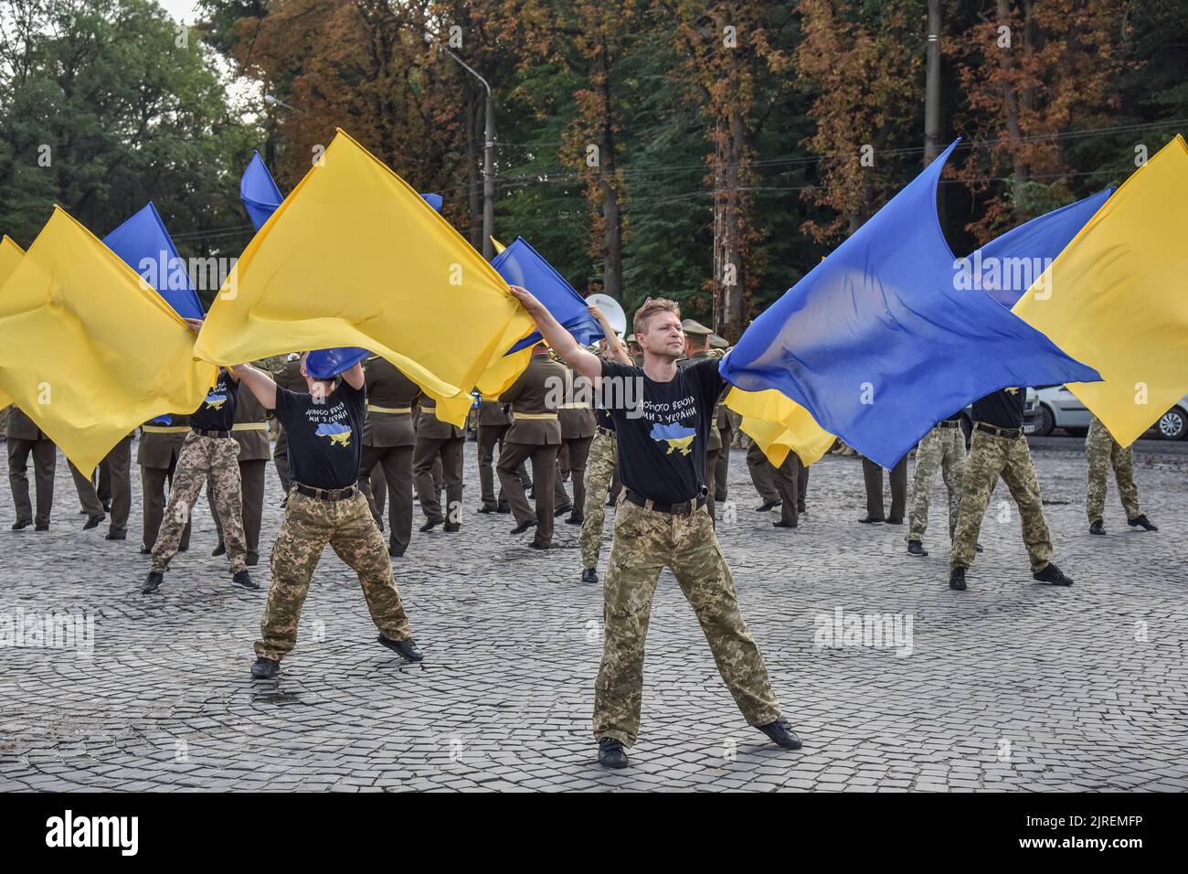 People dance with Ukrainian flags during the National Flag Day ...