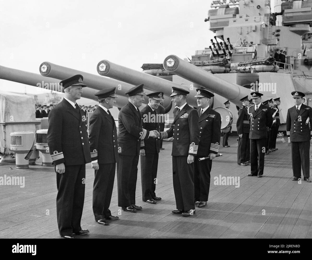 HM King George VI greeting the Flag Officers of the Home Fleet on board ...