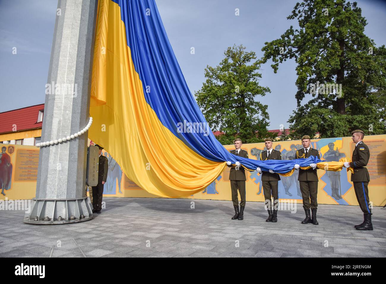 Ukrainian military participate in raising the flag of Ukraine during ...