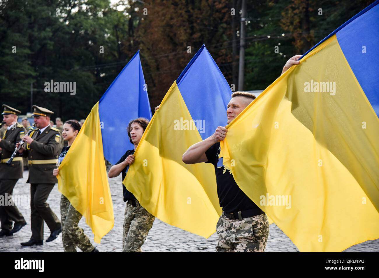 People dance with Ukrainian flags during the National Flag Day ...